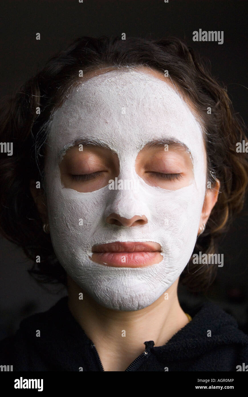 Young woman wearing face cleansing mask Stock Photo - Alamy