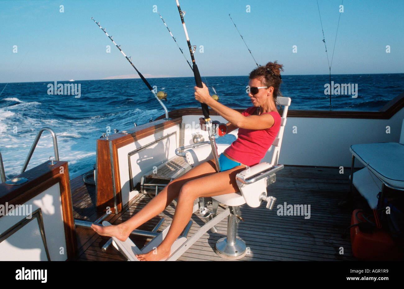 Woman fishing sea hi-res stock photography and images - Alamy