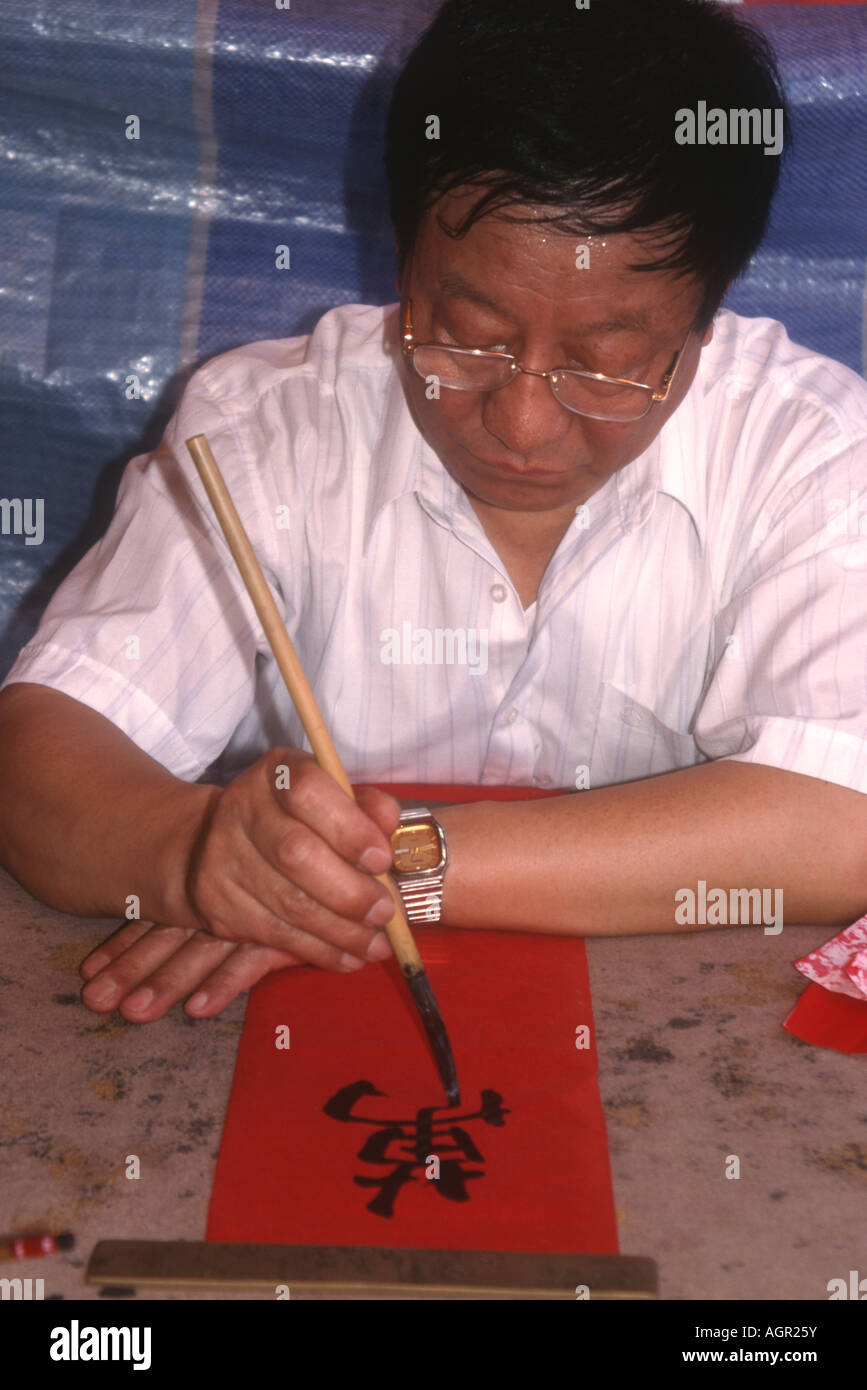 Calligraphy artist working in Chinatown,Singapore Stock Photo - Alamy