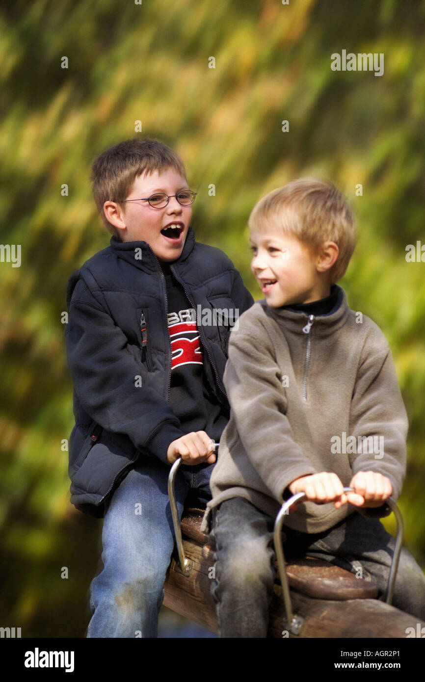 Children on see saw hi-res stock photography and images - Alamy
