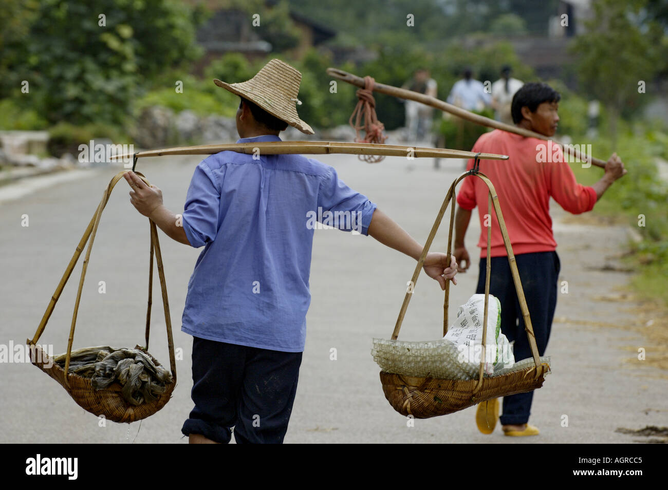 Two men carrying baskets hi-res stock photography and images - Alamy