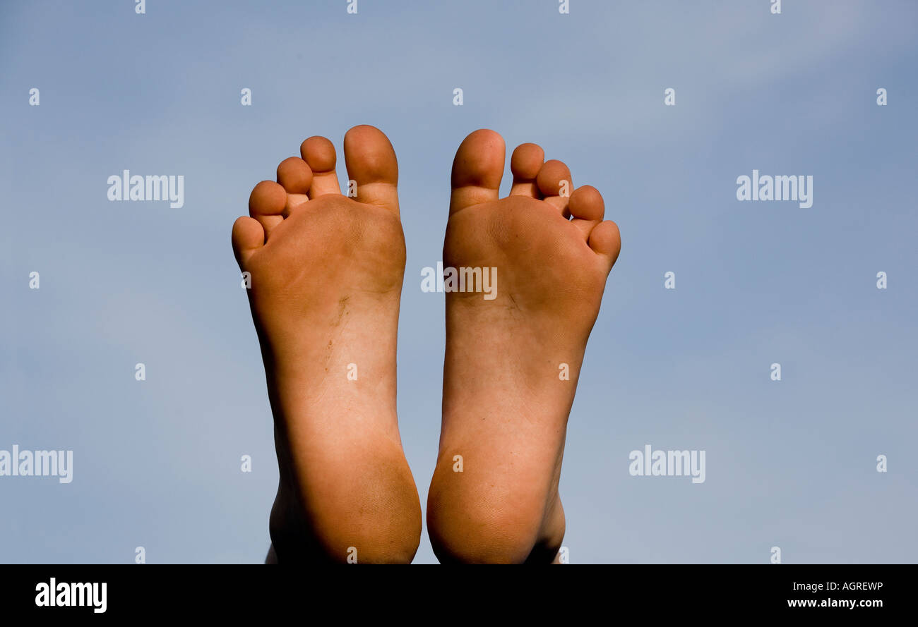 Feet with a sky background Stock Photo - Alamy