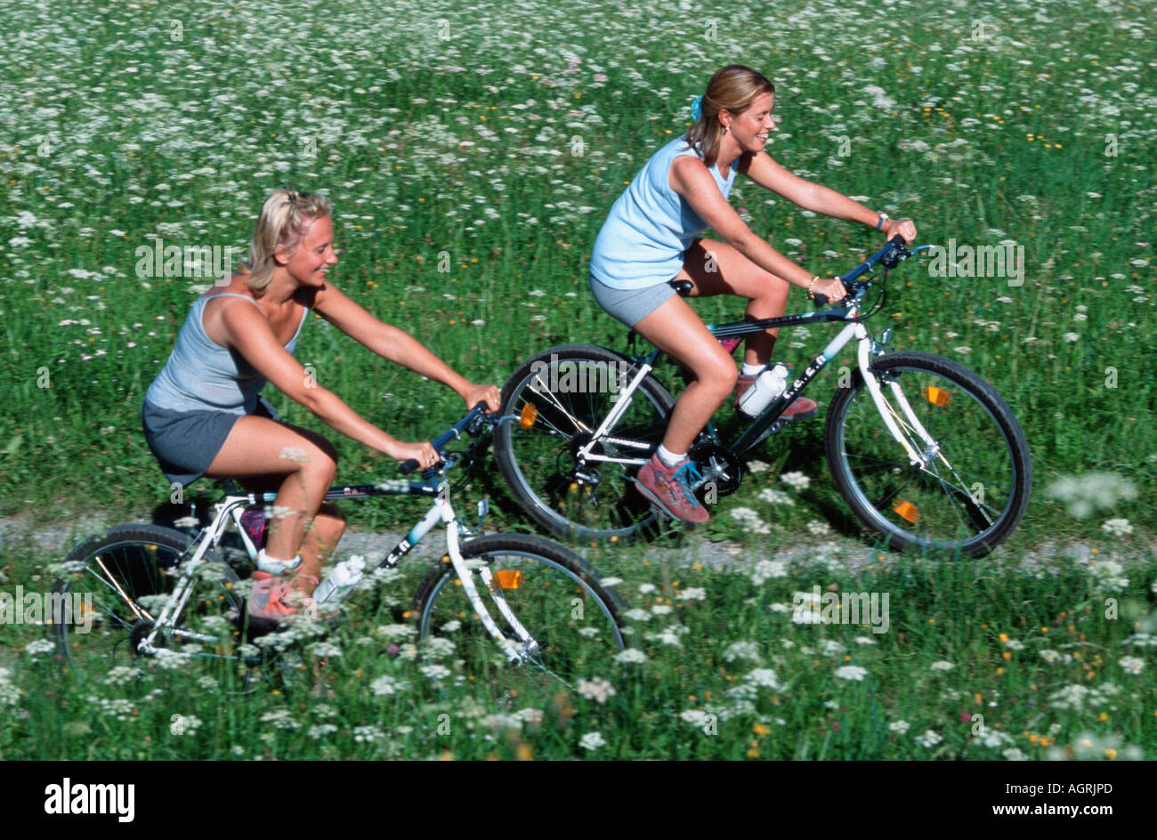 Girls on bicycles Stock Photo - Alamy