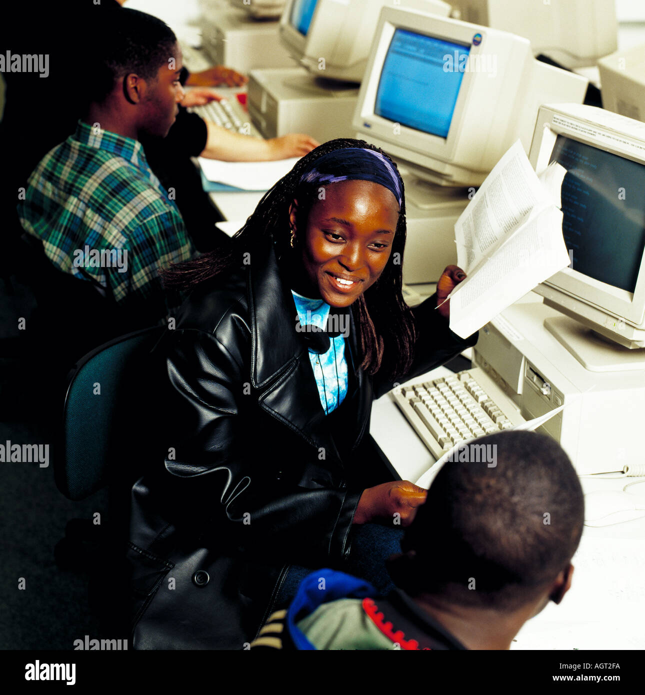 Black female Student writing on a computer Stock Photo - Alamy