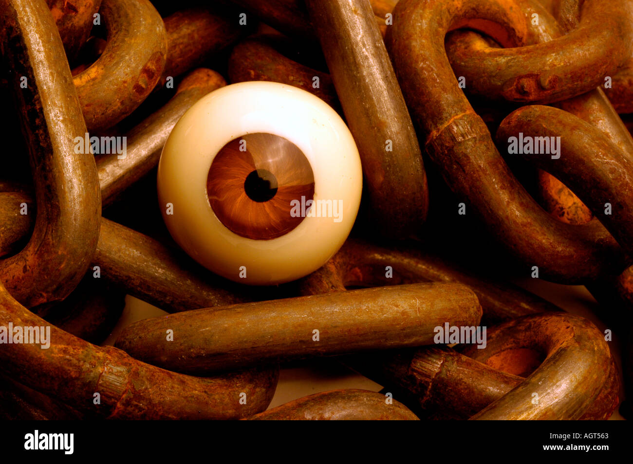 Eye and chain concept Stock Photo - Alamy