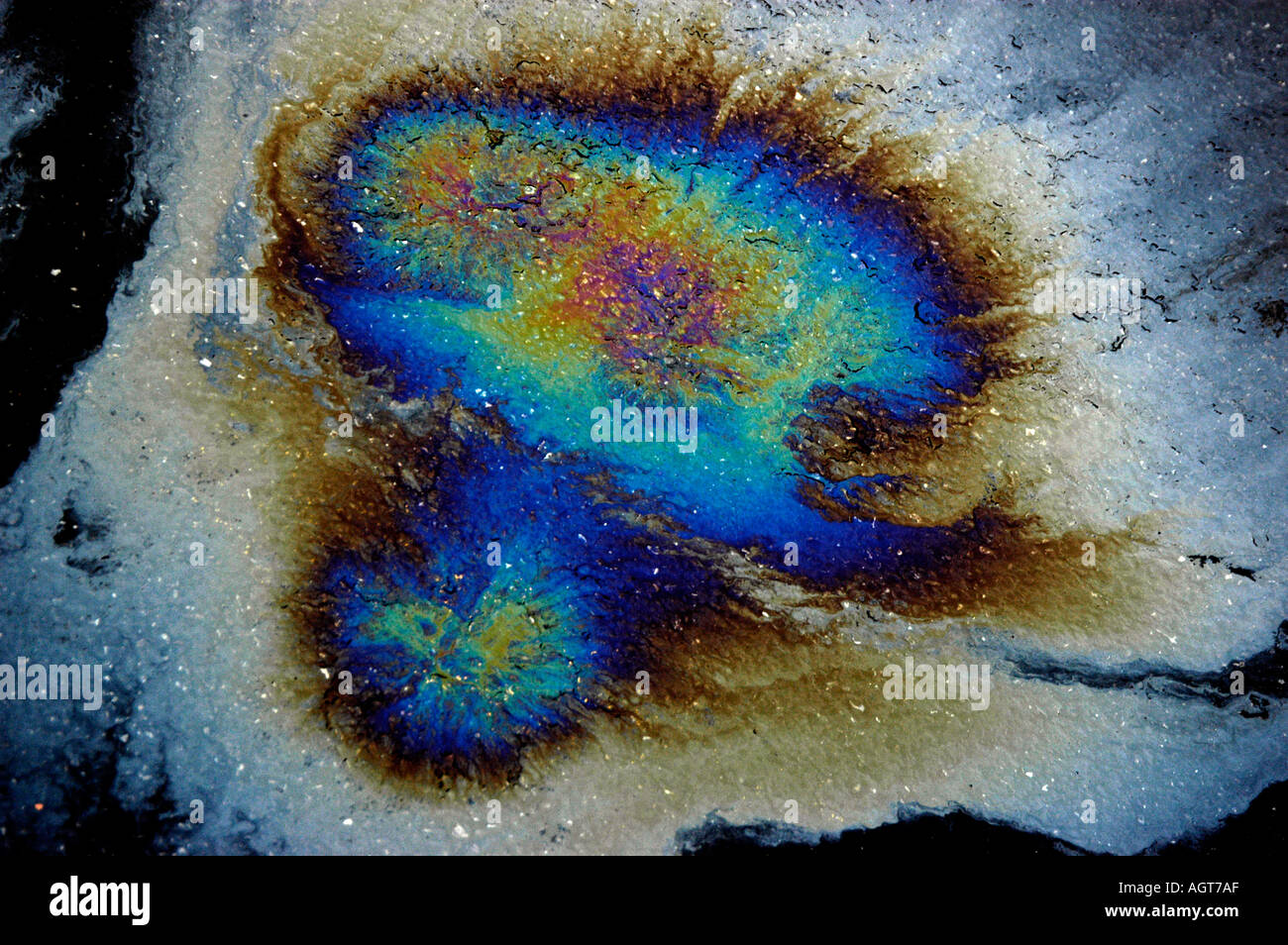 Oil slick on blacktop Stock Photo - Alamy