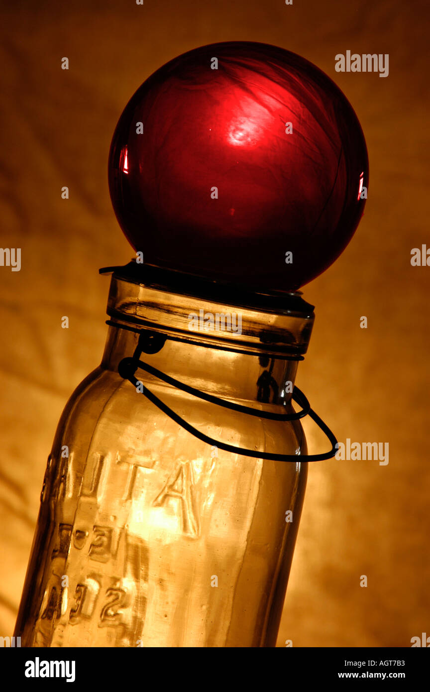 Still life with antique bottle and glass ball Stock Photo - Alamy