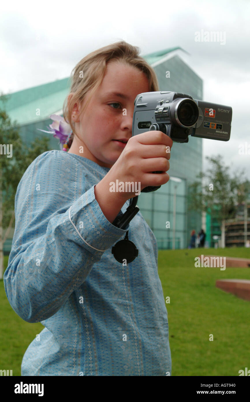 a young girl using a video camera Stock Photo - Alamy