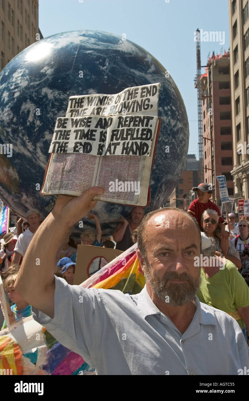 Man carrying Bible warns of end of world Stock Photo - Alamy