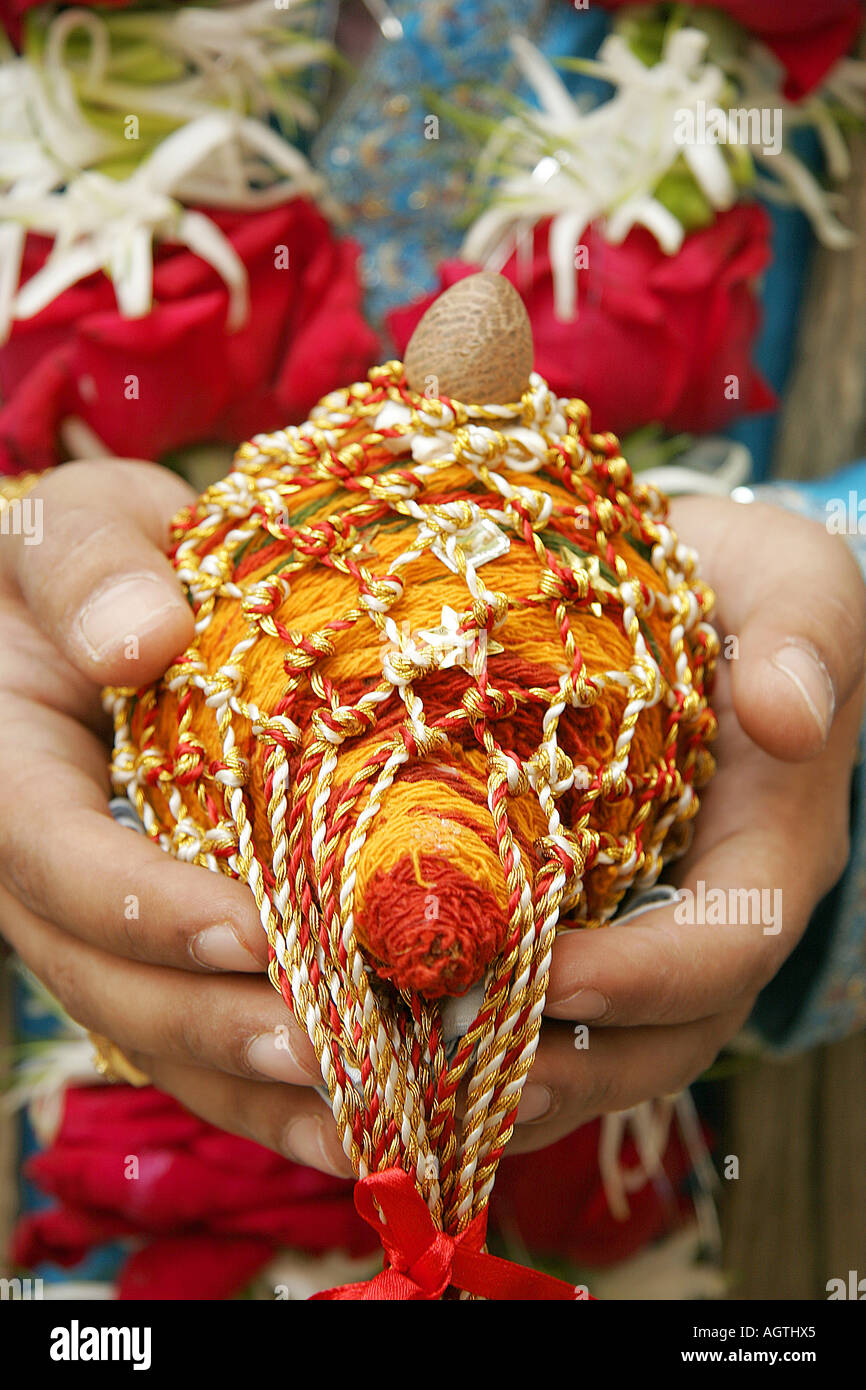 Indian Gujrati Groom holding a decorated dried coconut during his ...