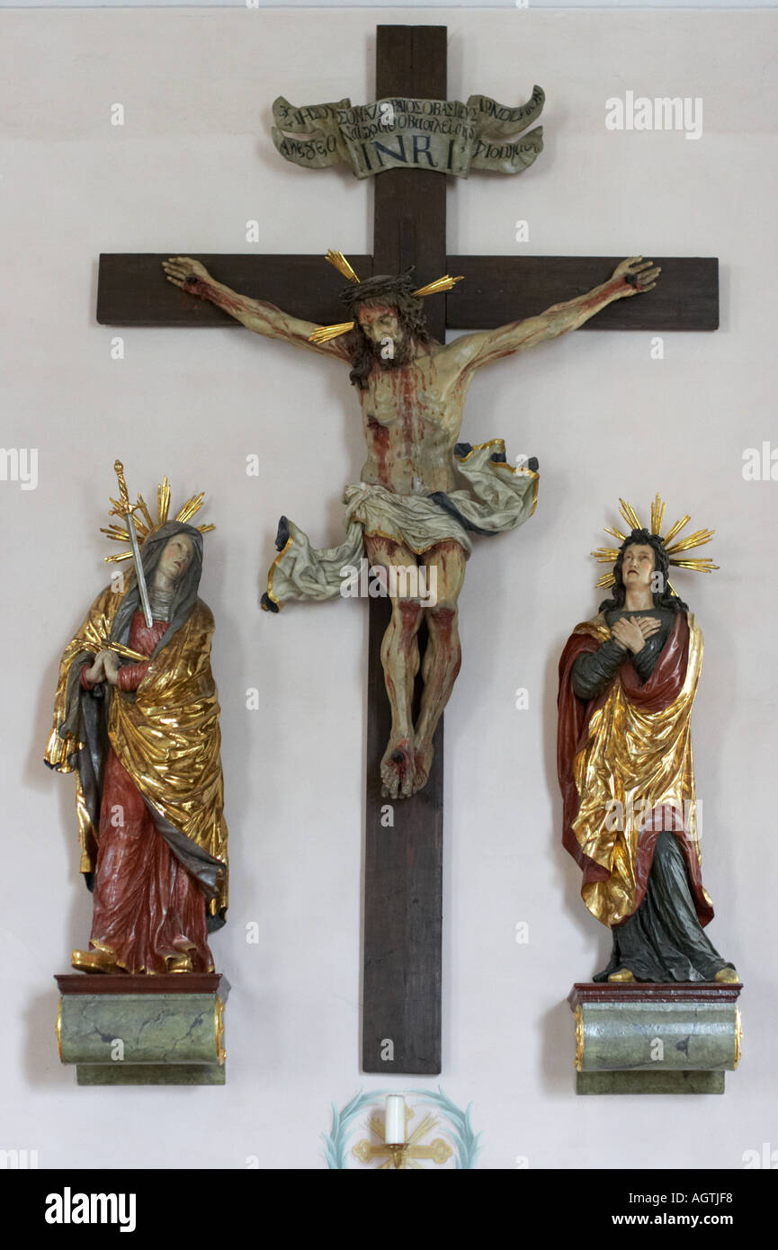 Painted statues depicting the crucifixion of Jesus Christ inside the ...