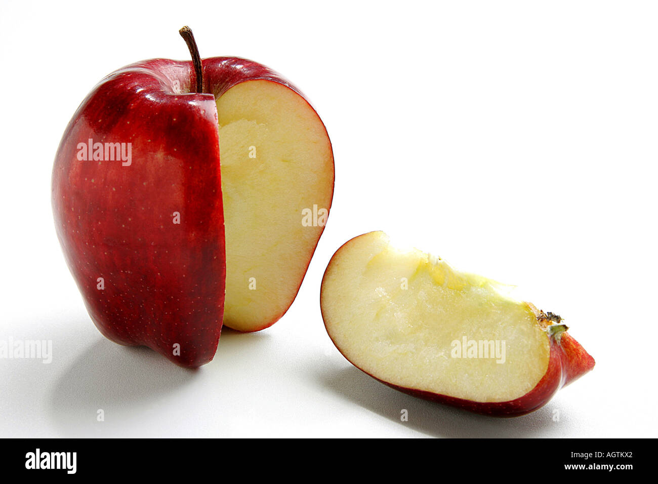 One red apple with one piece cut healthy fruit on white background ...