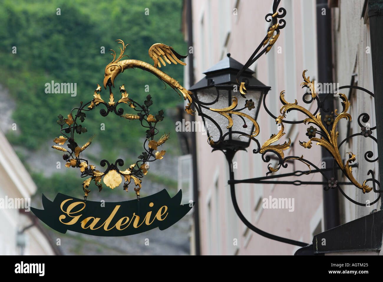 Ornate wrought-iron shop sign on historic Getreidegasse Street in the ...