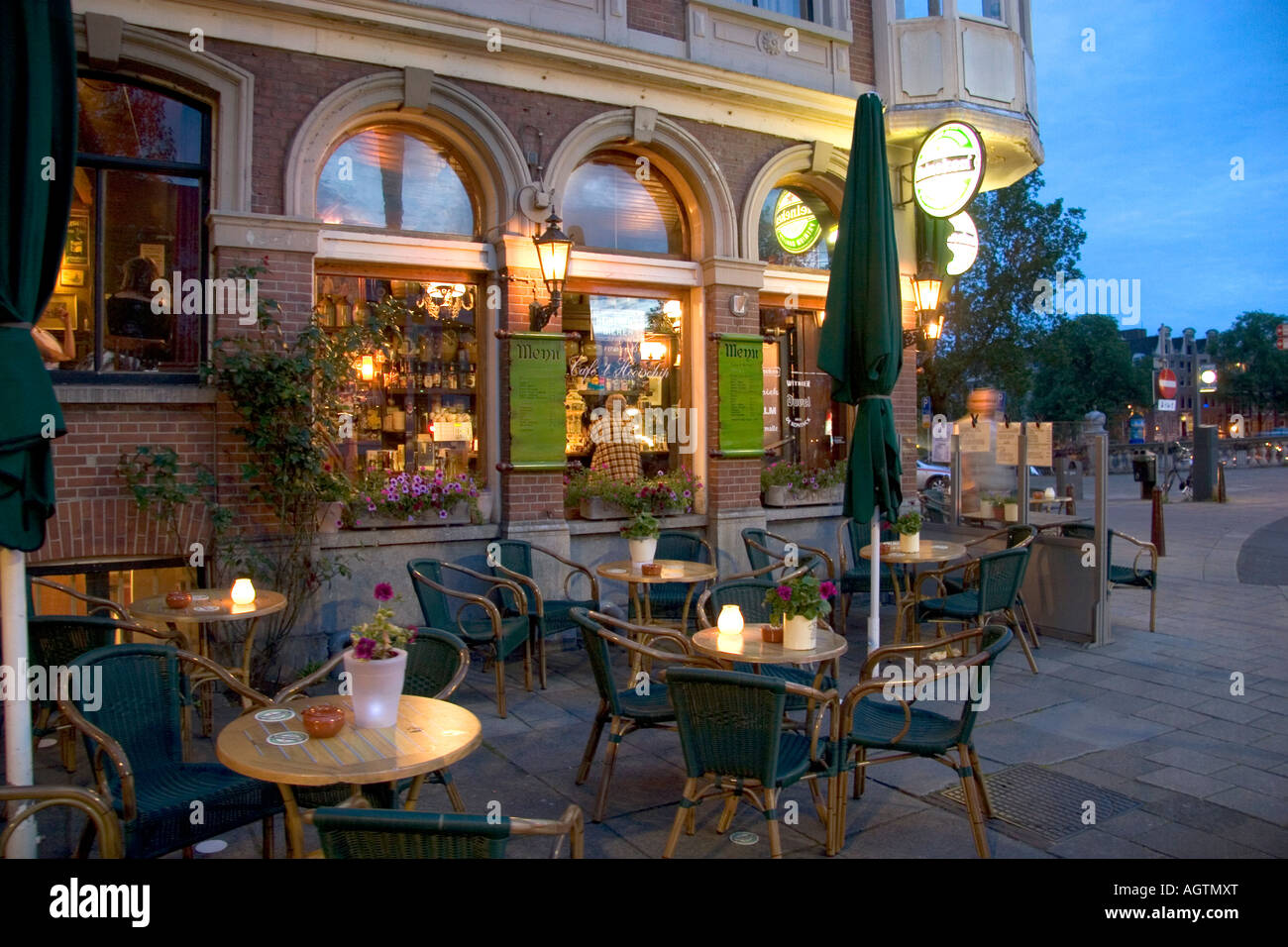 A sidewalk cafe at dusk in Amsterdam Netherlands Stock Photo - Alamy