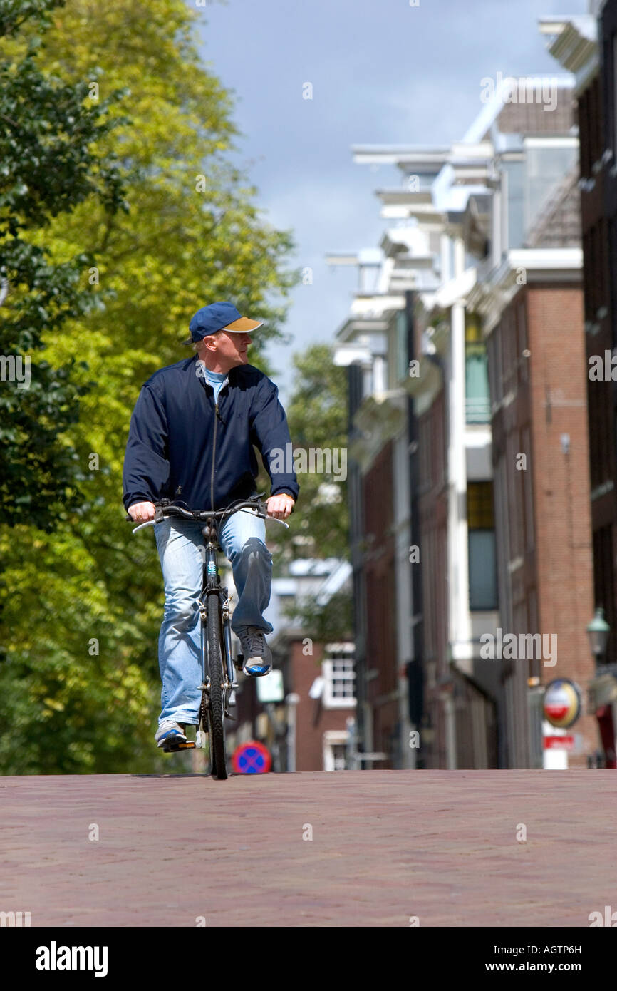 Man riding bike bicycle hi-res stock photography and images - Alamy