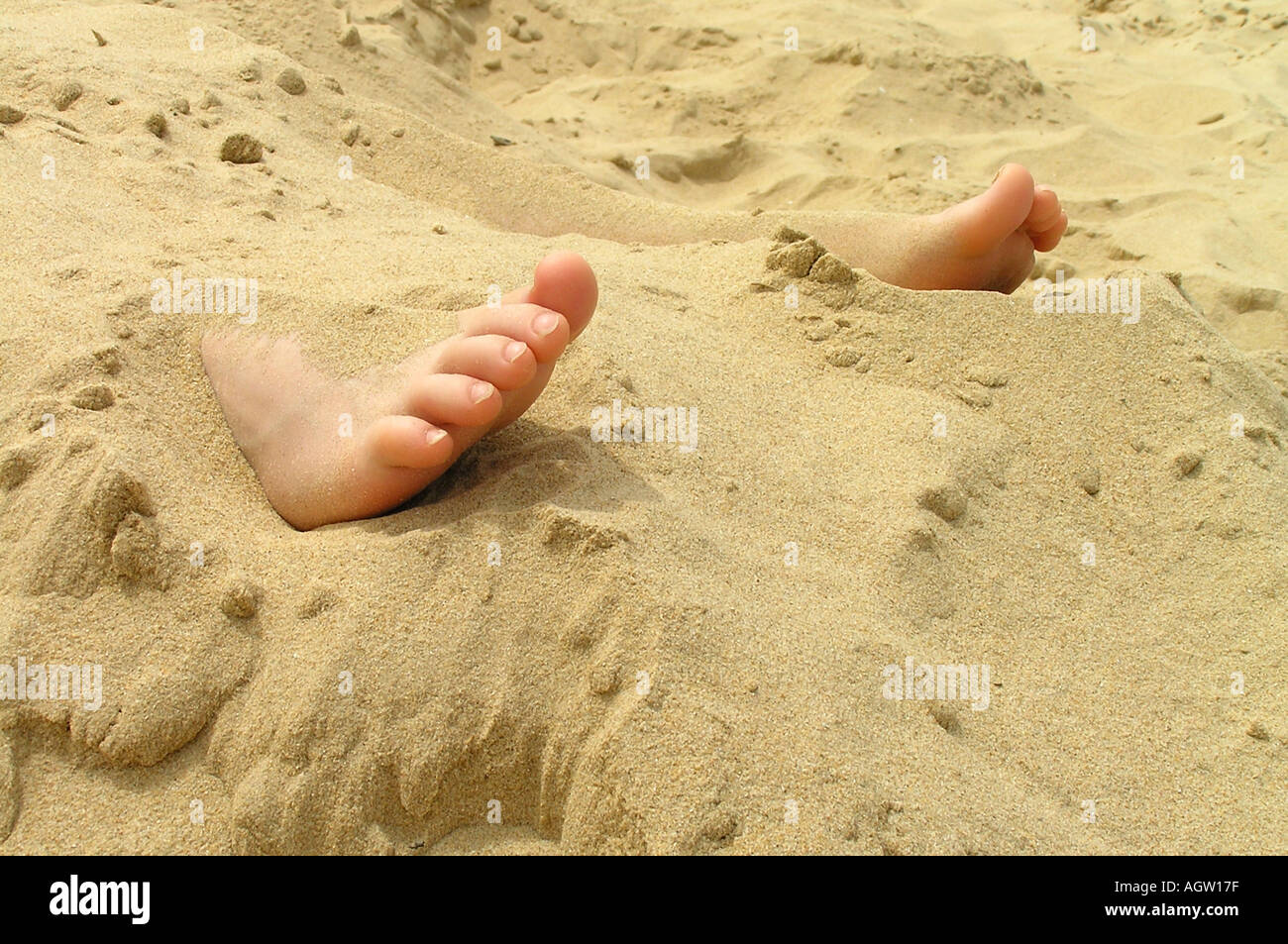 Feet buried in sand hi-res stock photography and images - Alamy