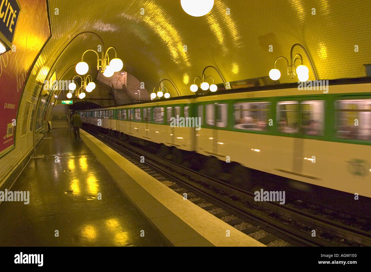 Paris metro showing golden underground lighting Stock Photo - Alamy