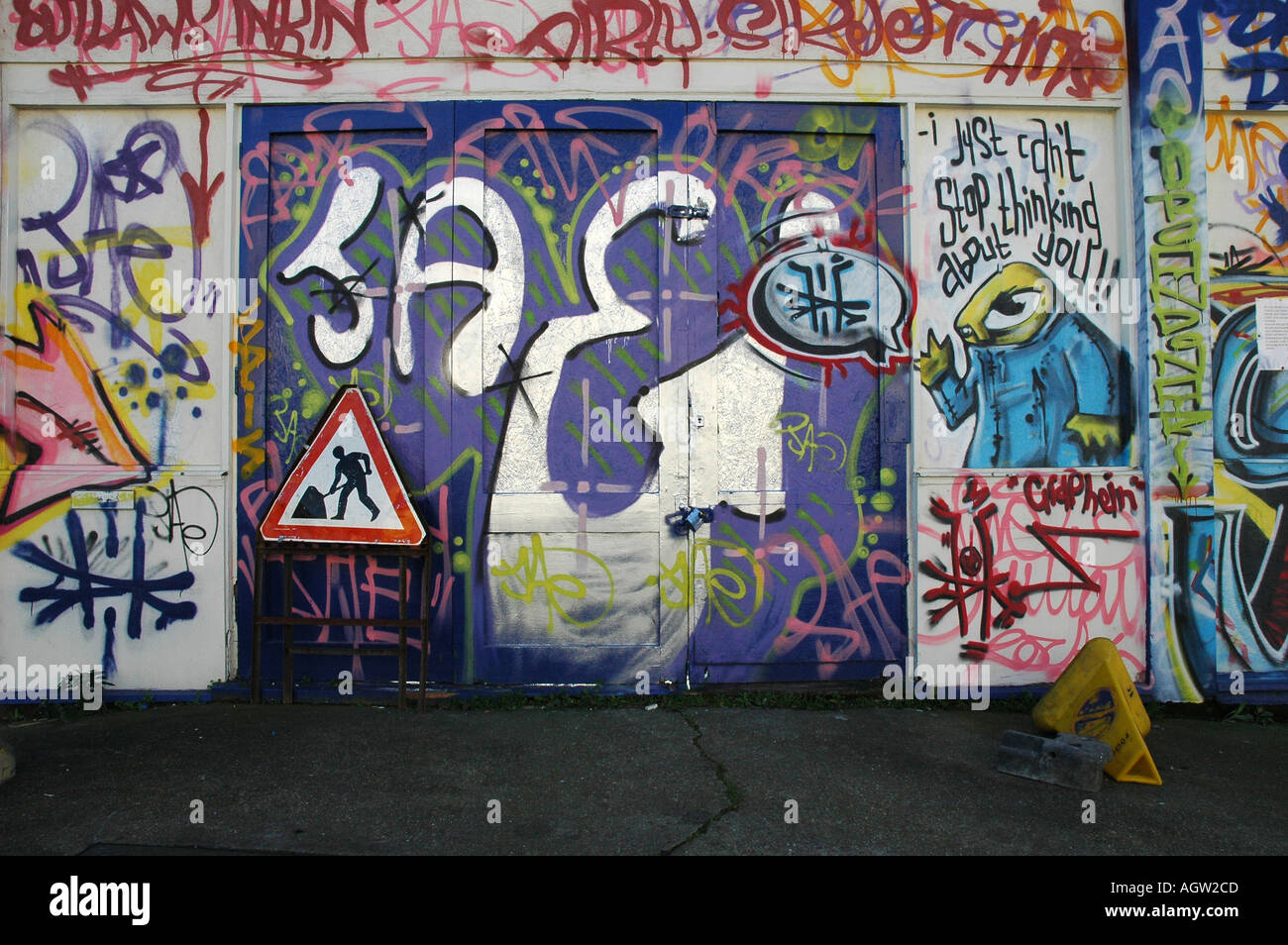 Graffiti on garage wall Stock Photo - Alamy