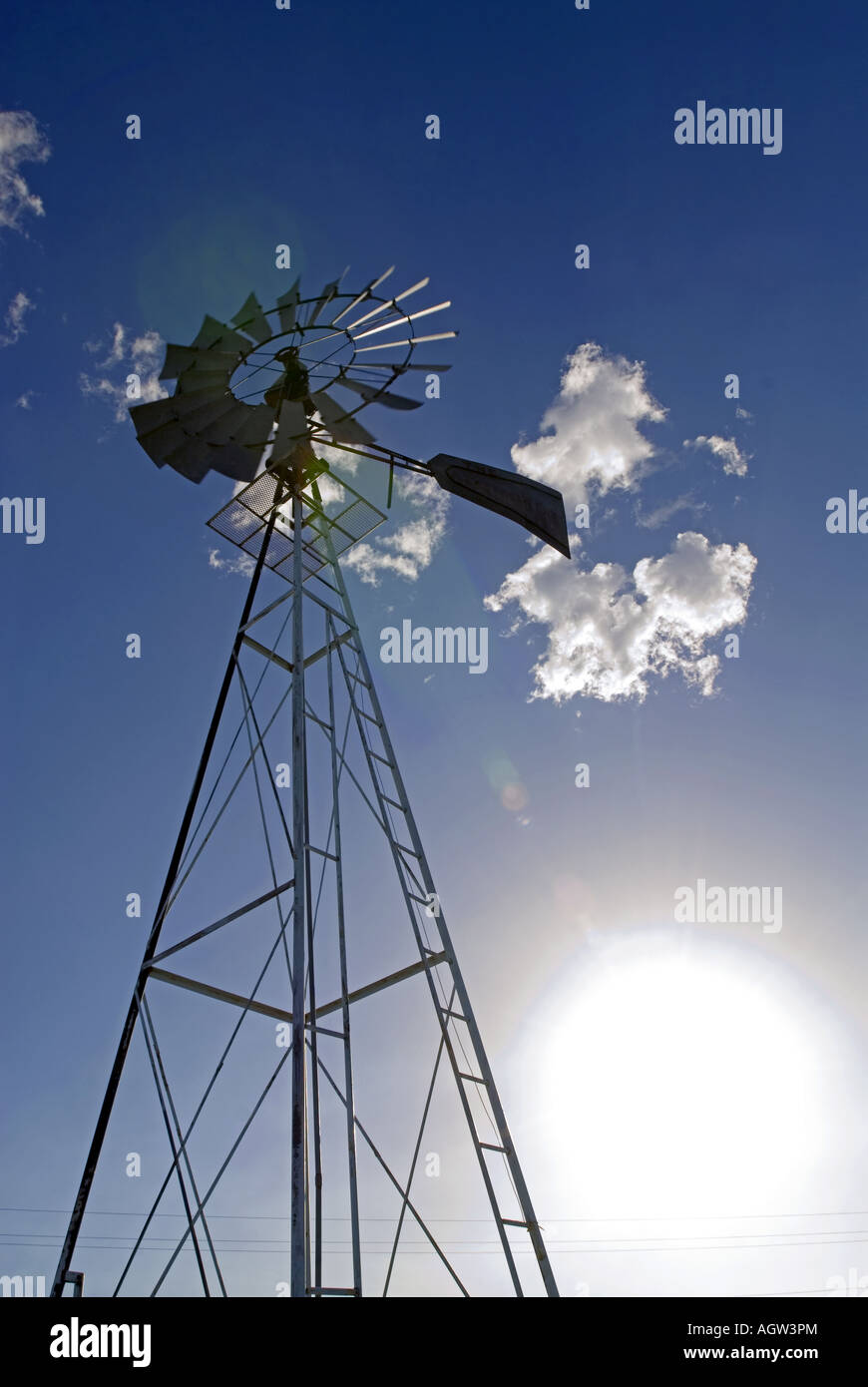 Ranch windmill sunset Cerillos New Mexico USA Stock Photo - Alamy