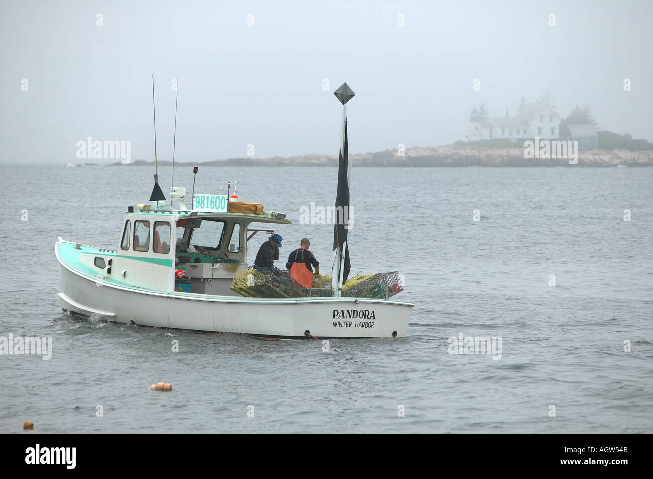 Lobster boat off of Schoodic Peninsula Winter Harbor Light sits on Mark ...