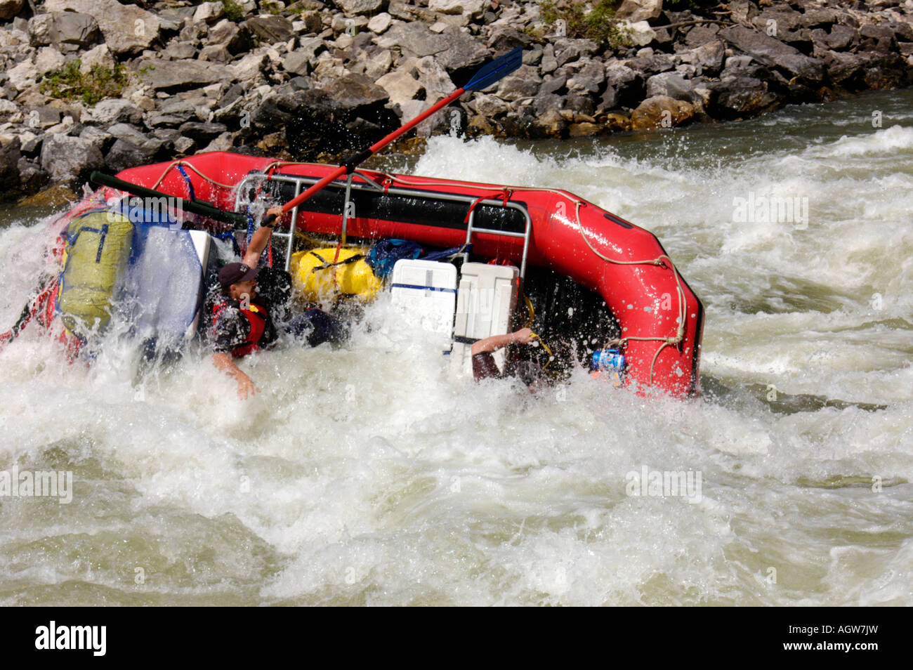 Rafters hit a huge wave and flip their boat while rafting Cramer Creek ...
