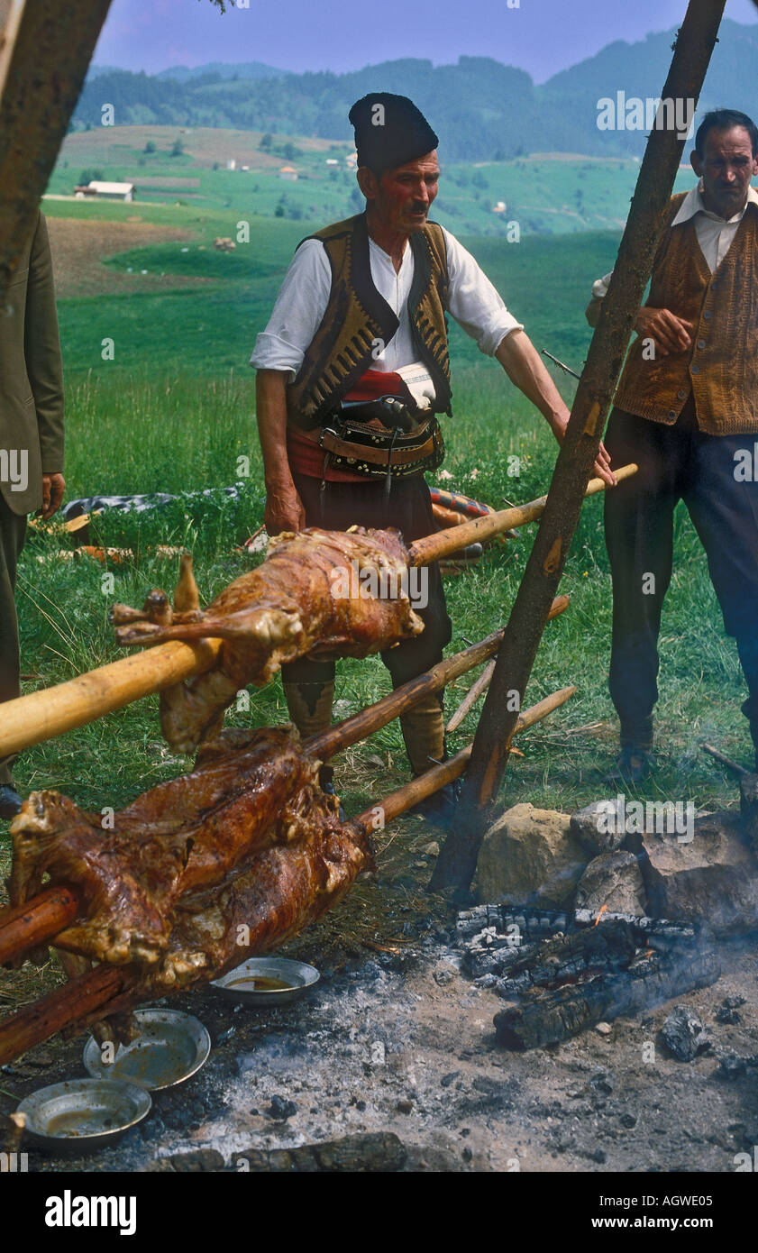 Villager roasting sheep for a village barbecue in Bulgaria Stock Photo ...