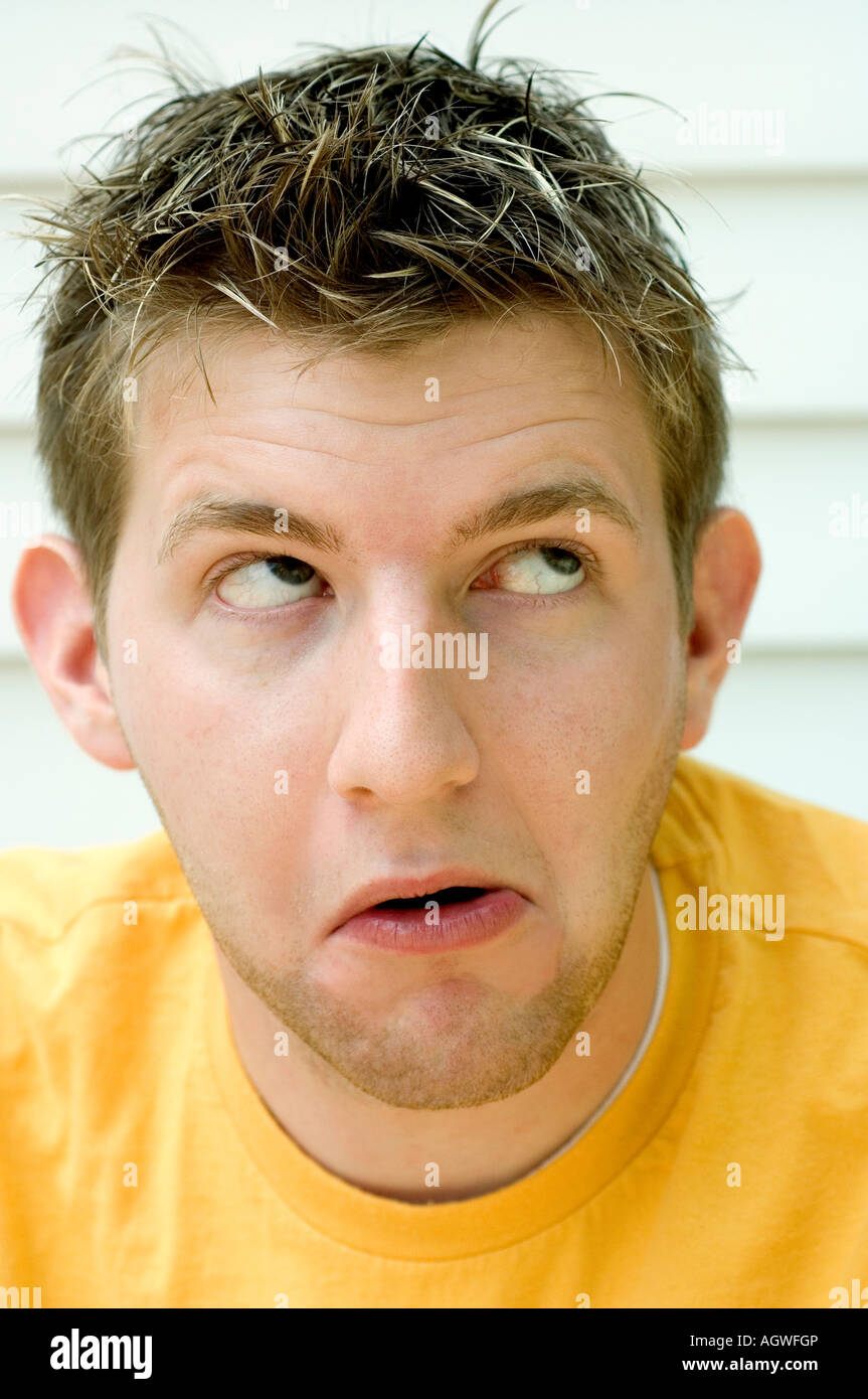 Young man making silly face Stock Photo - Alamy