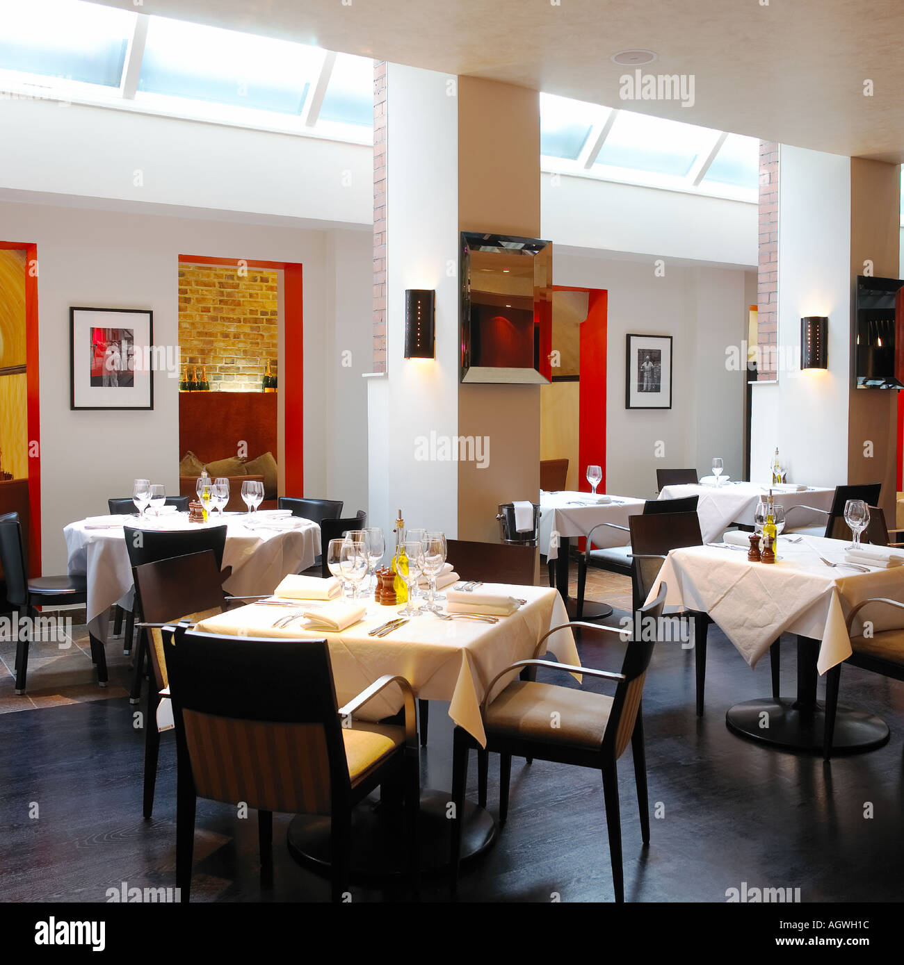 Tables set in stylish hotel restaurant Stock Photo - Alamy