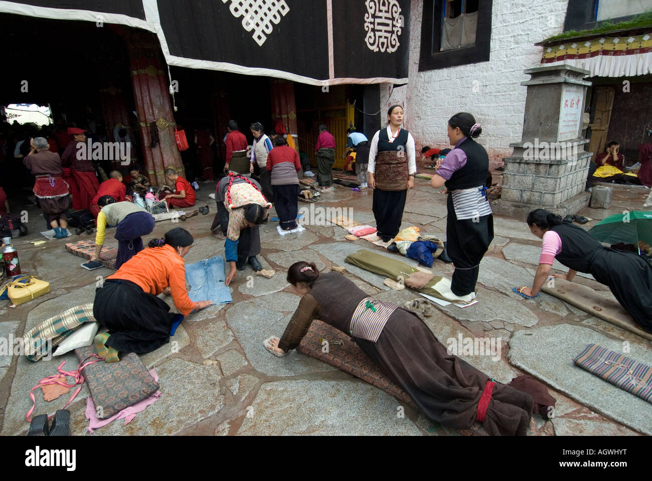 TIBET China Lhasa Buddhist pilgrims pray and prostrate themselves in ...