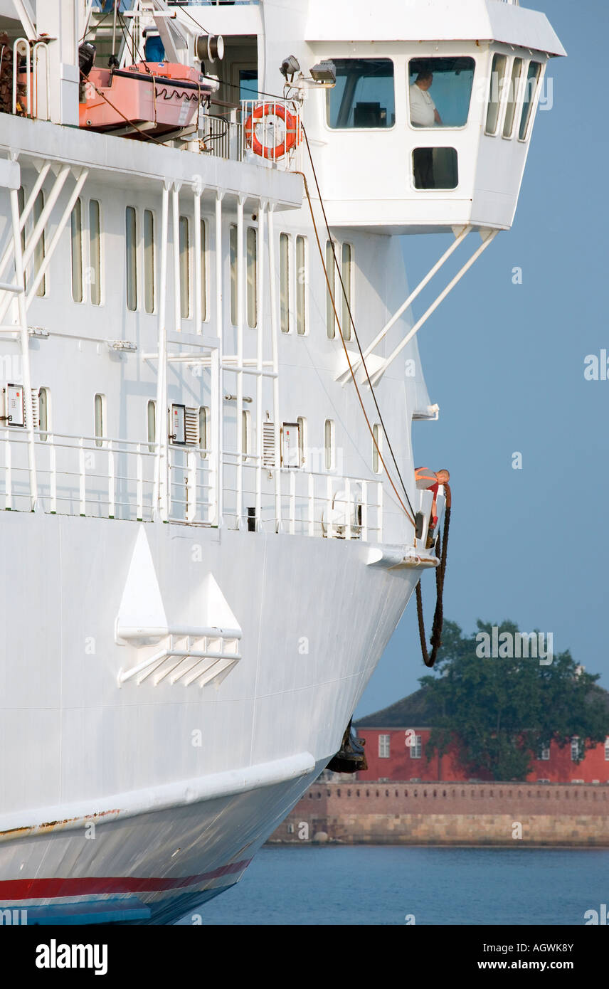 A ferry manoeuvring before it docks in the warm light of the afternoon ...