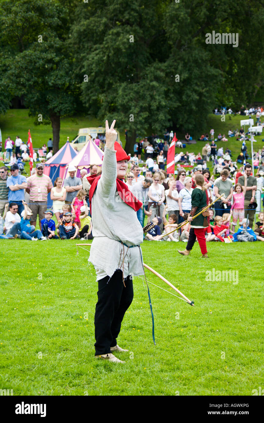 Longbow archer showing v-sign flicking the v showing two bow fingers ...