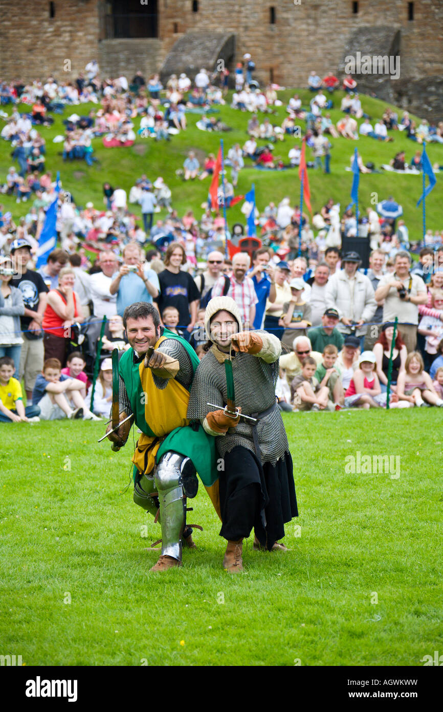 Medieval reenactors dressed in armour holding broadswords Stock Photo ...