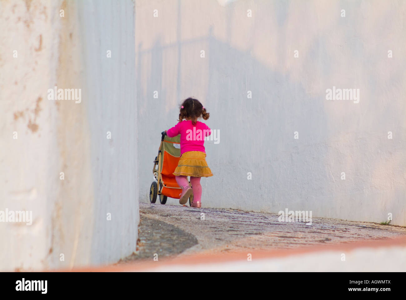 Girl pushing baby carriage hi-res stock photography and images - Alamy