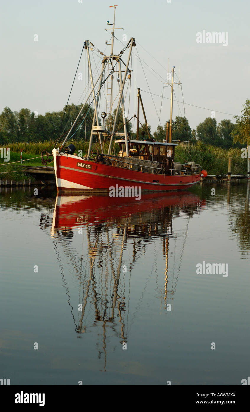 red boat on a river trawler Stock Photo - Alamy