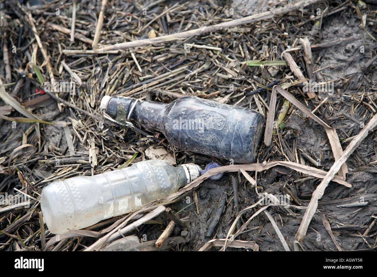 Glass and Plastic Bottles washed up on riverbank 001 Stock Photo - Alamy