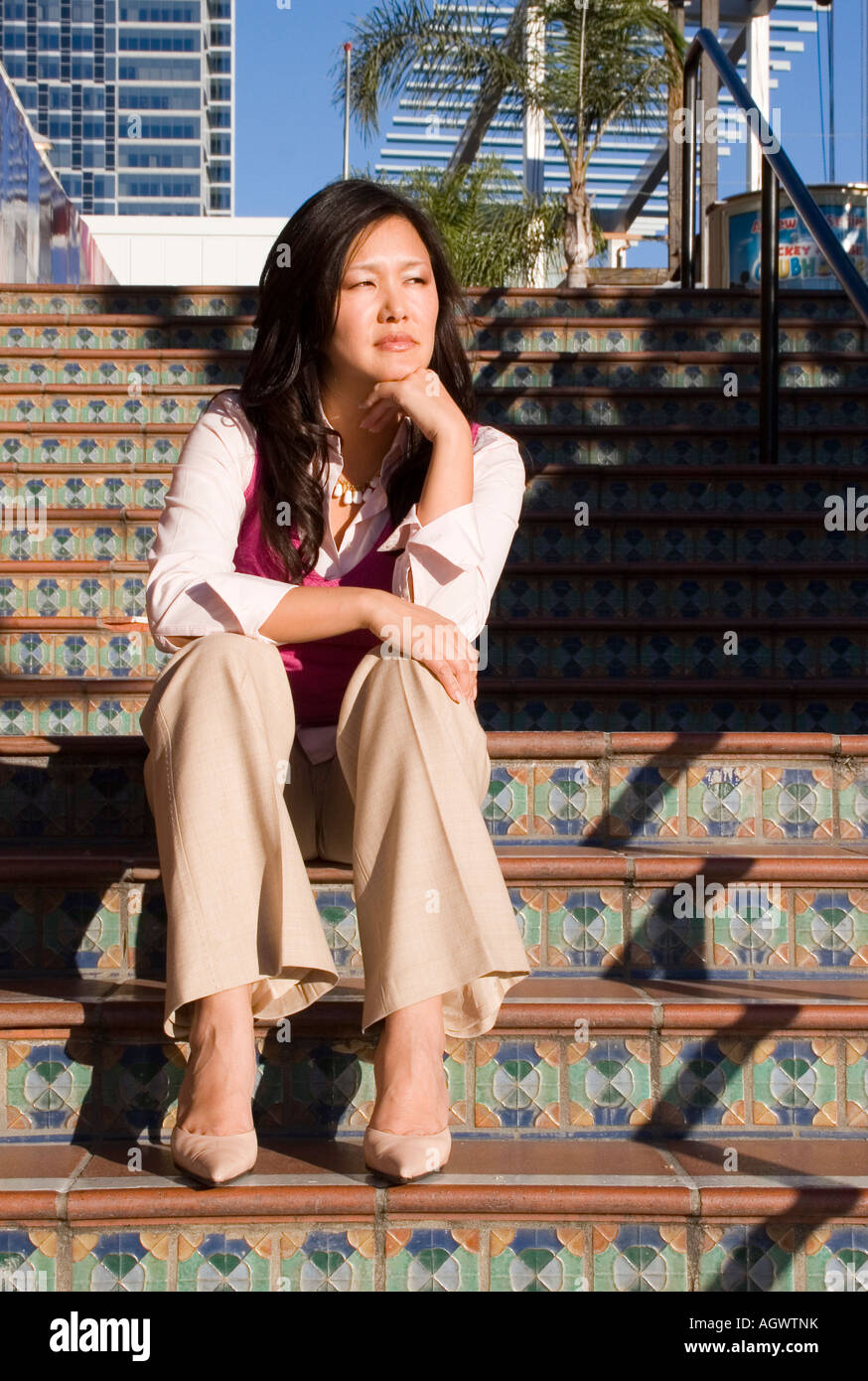 Woman Sitting on Steps Stock Photo - Alamy