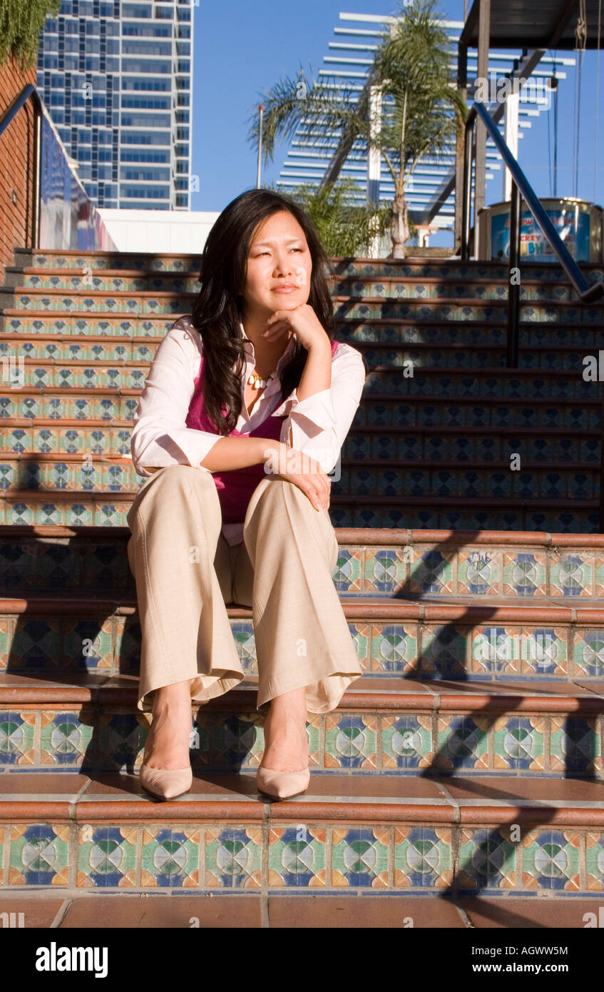 Woman Sitting on Steps Stock Photo - Alamy