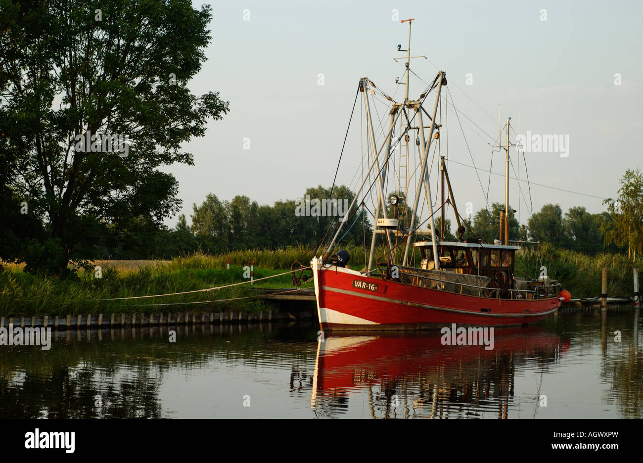 red boat on a river trawler Stock Photo - Alamy