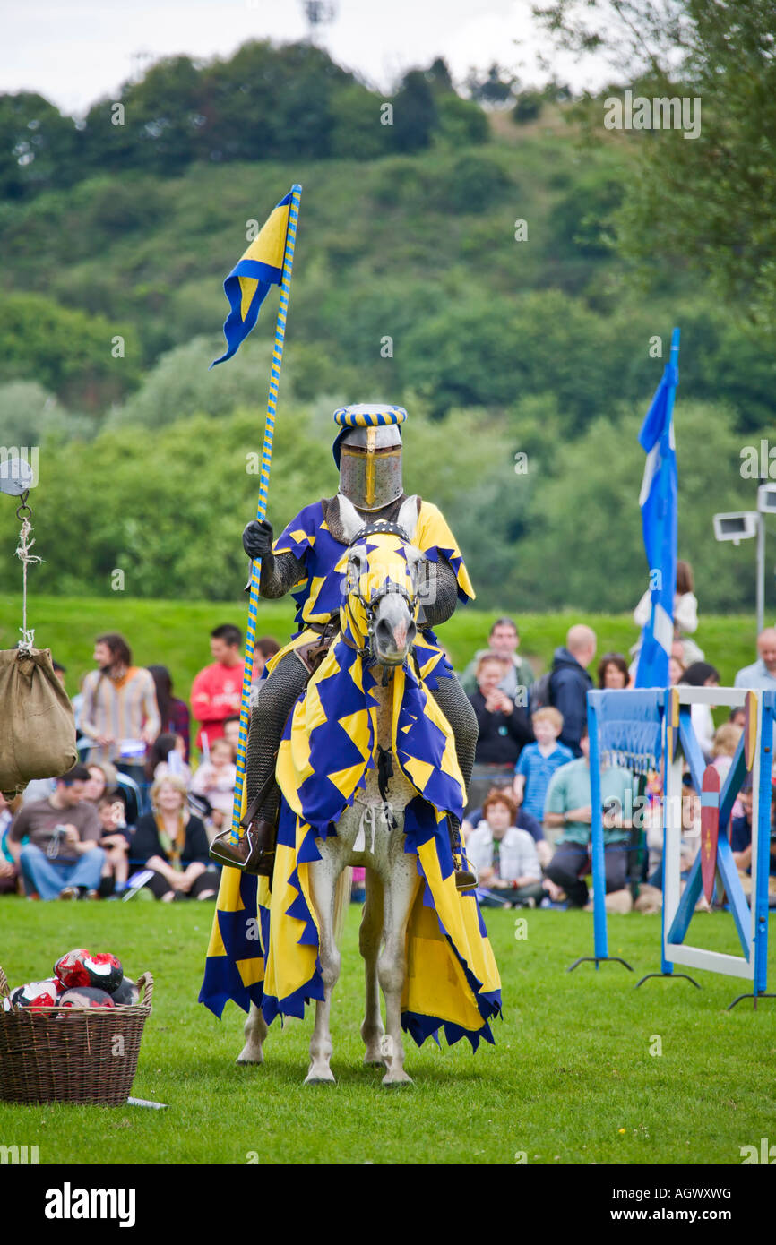Medieval knight on horseback holding lance during reenactment ...