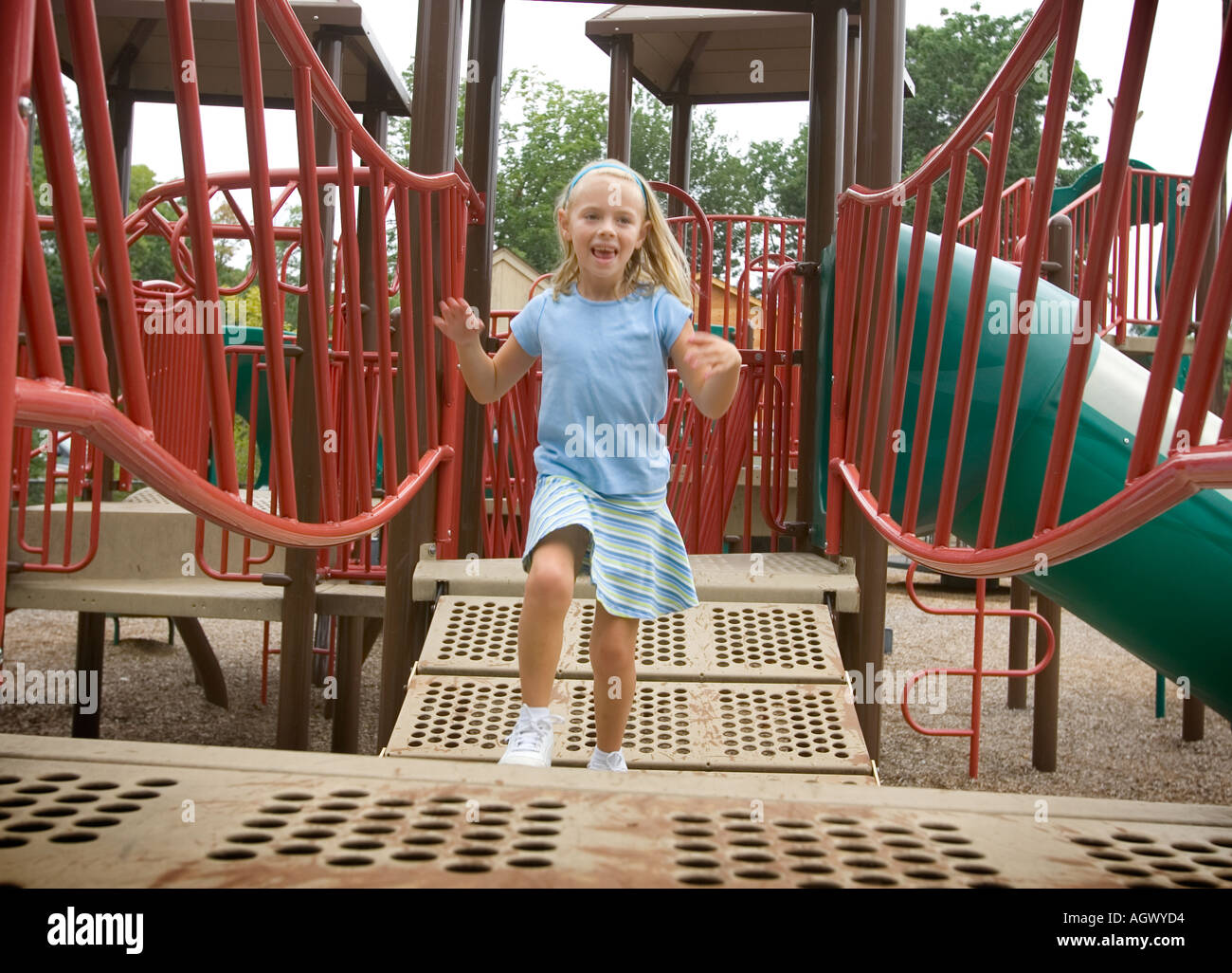 Child running across a playground bridge Stock Photo - Alamy