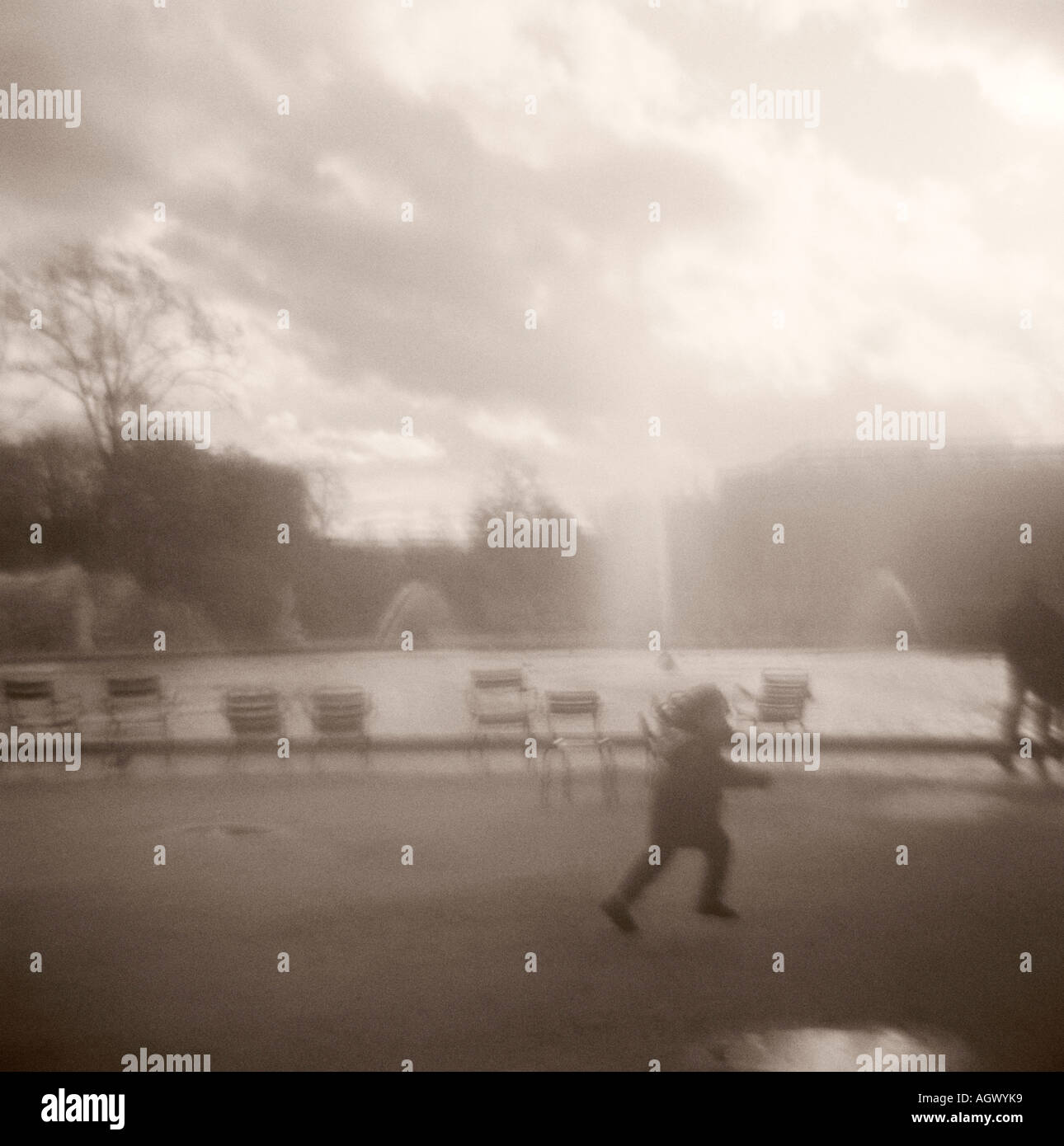 Girl Running through the Tuileries Gardens - Paris, France Stock Photo ...