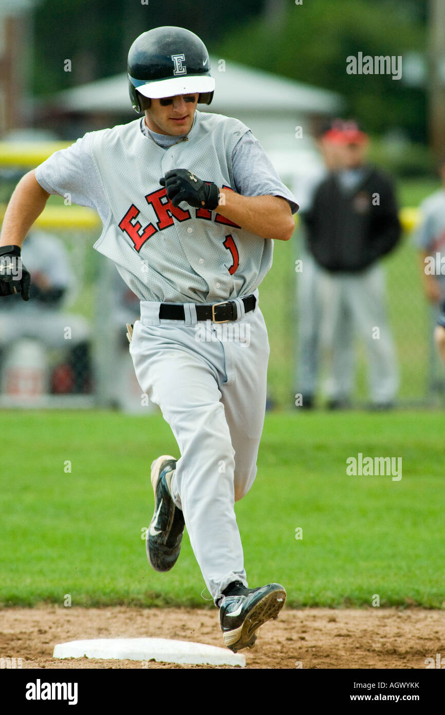 A college baseball player makes it to first base Stock Photo - Alamy