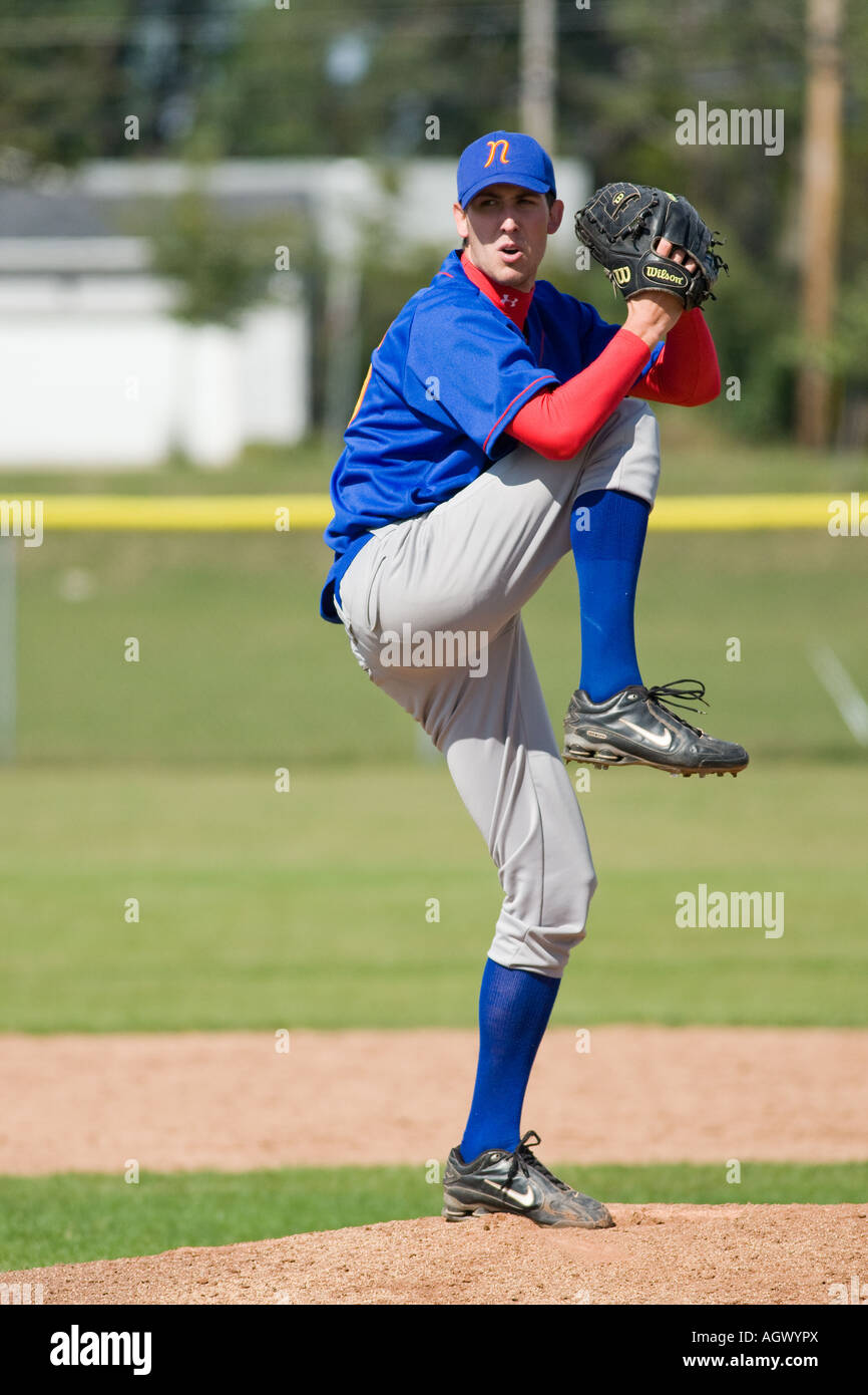 A college baseball player pitching Stock Photo - Alamy