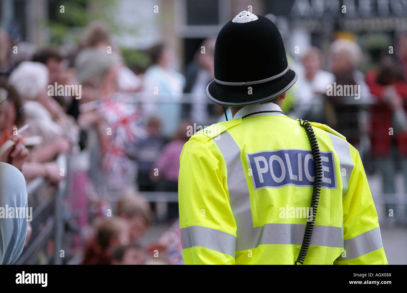 Policeman looking at the crowd fluorescent jacket traditional police ...