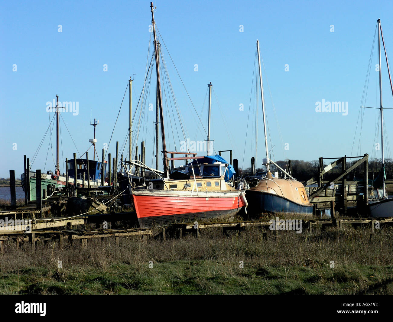 Boats and jetties at Skippool Creek Lancashire England Stock Photo - Alamy