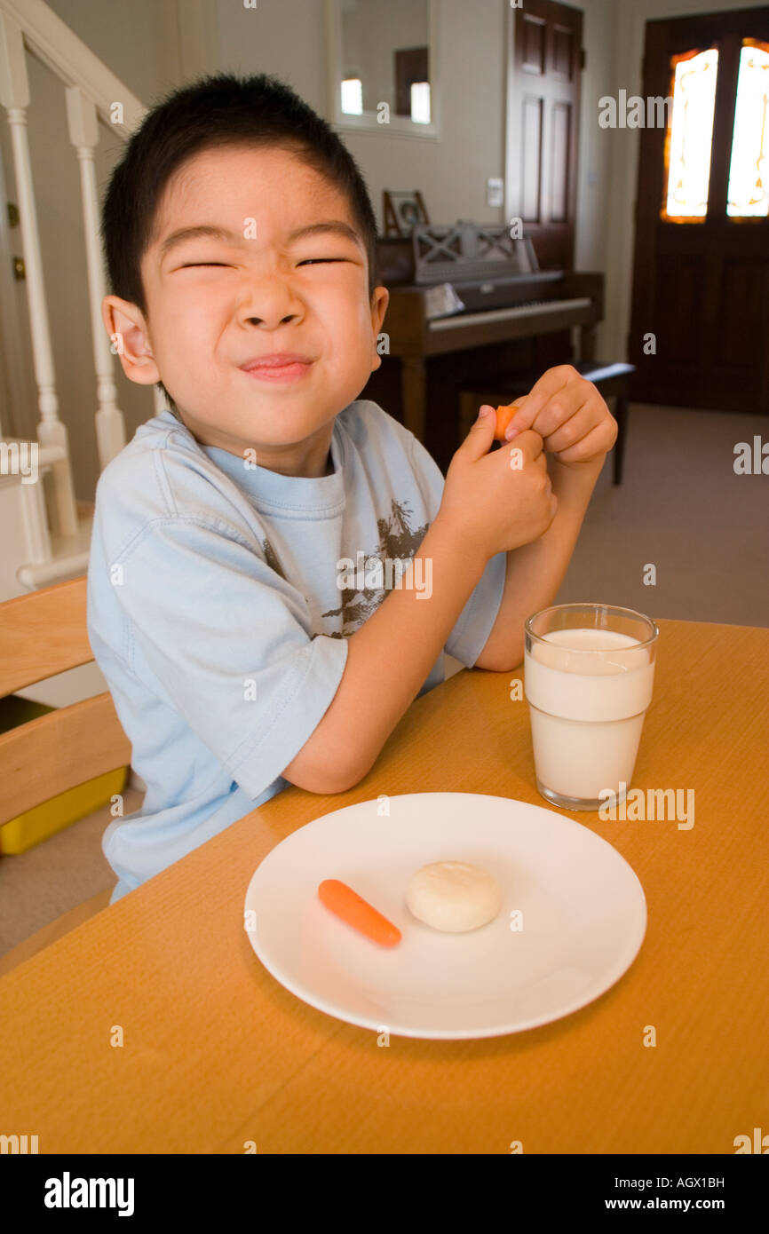Little Boy Eating Snack Stock Photo - Alamy