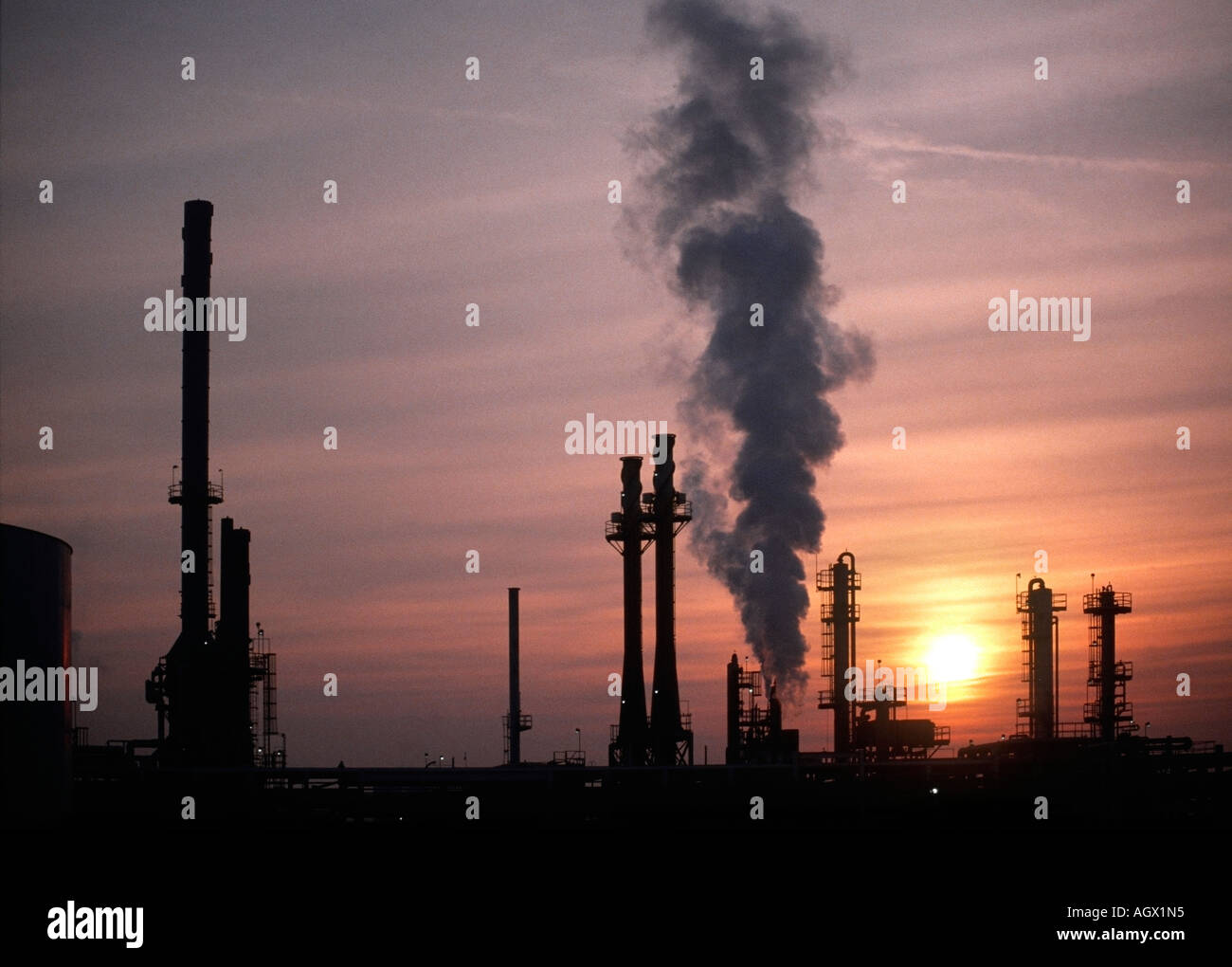 Sunset over oil refinery Stock Photo - Alamy