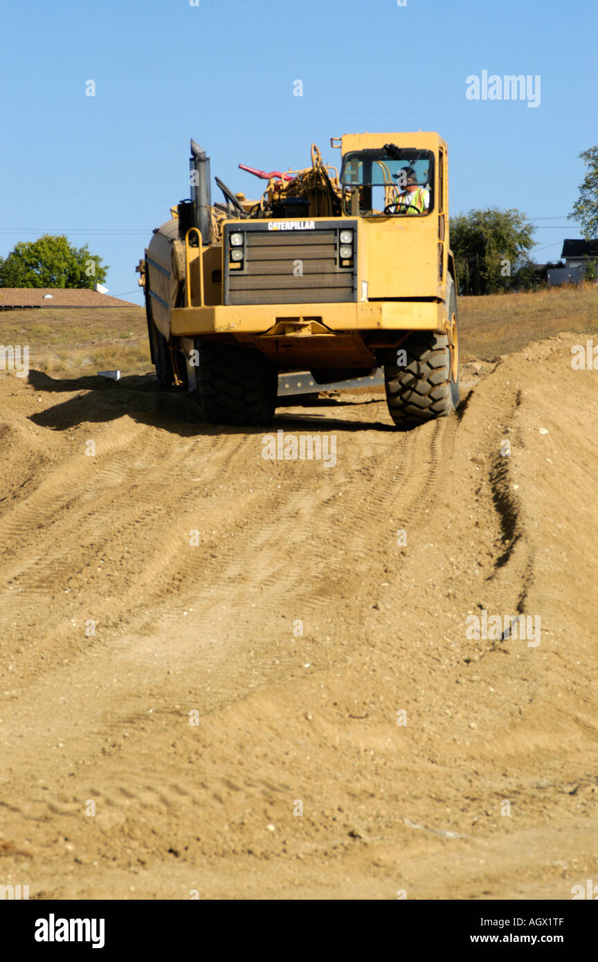 Earthmover readies ground for development Stock Photo - Alamy