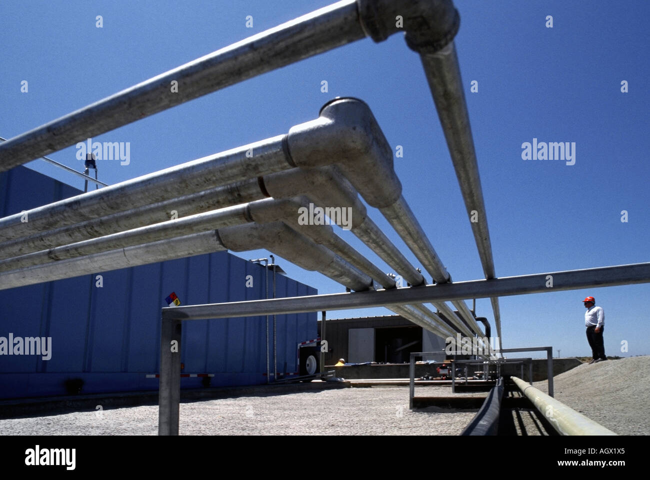 Worker and oil lines Stock Photo - Alamy