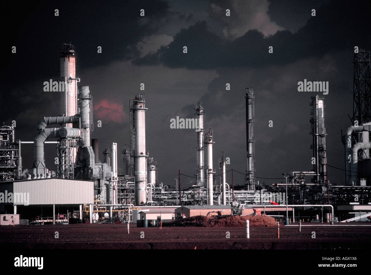 Oil refinery with dark sky and storm coming Stock Photo - Alamy